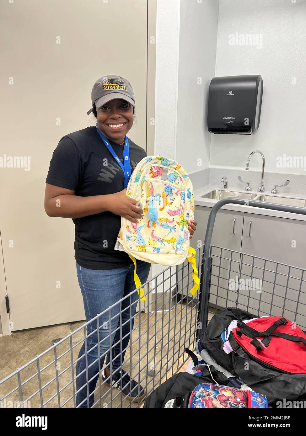 Theresa Gant-Gaines, hydraulic engineer, holds a backpack donated to ...