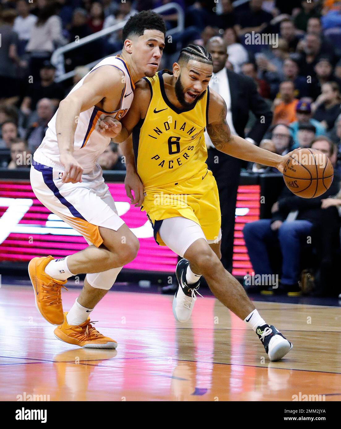 Indiana Pacers guard Cory Joseph (6) drives past Phoenix Suns guard Devin Booker during the ...