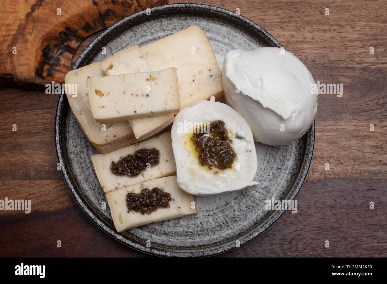 Italian cheese collection, yellow taleggio cheese and white mozzarella ...