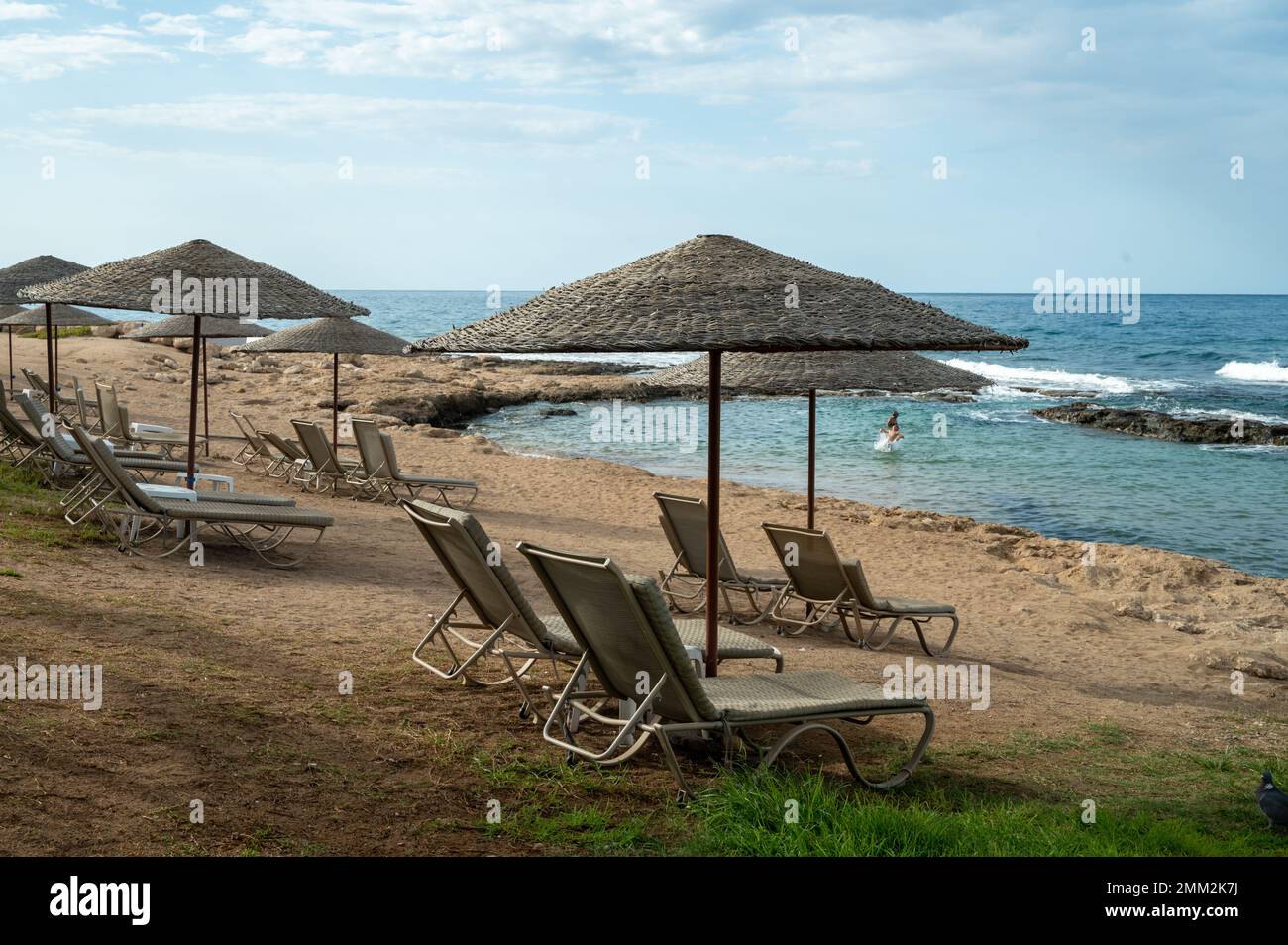Vacation resorts on Cyprus near Paprhos with green grass, beach ...
