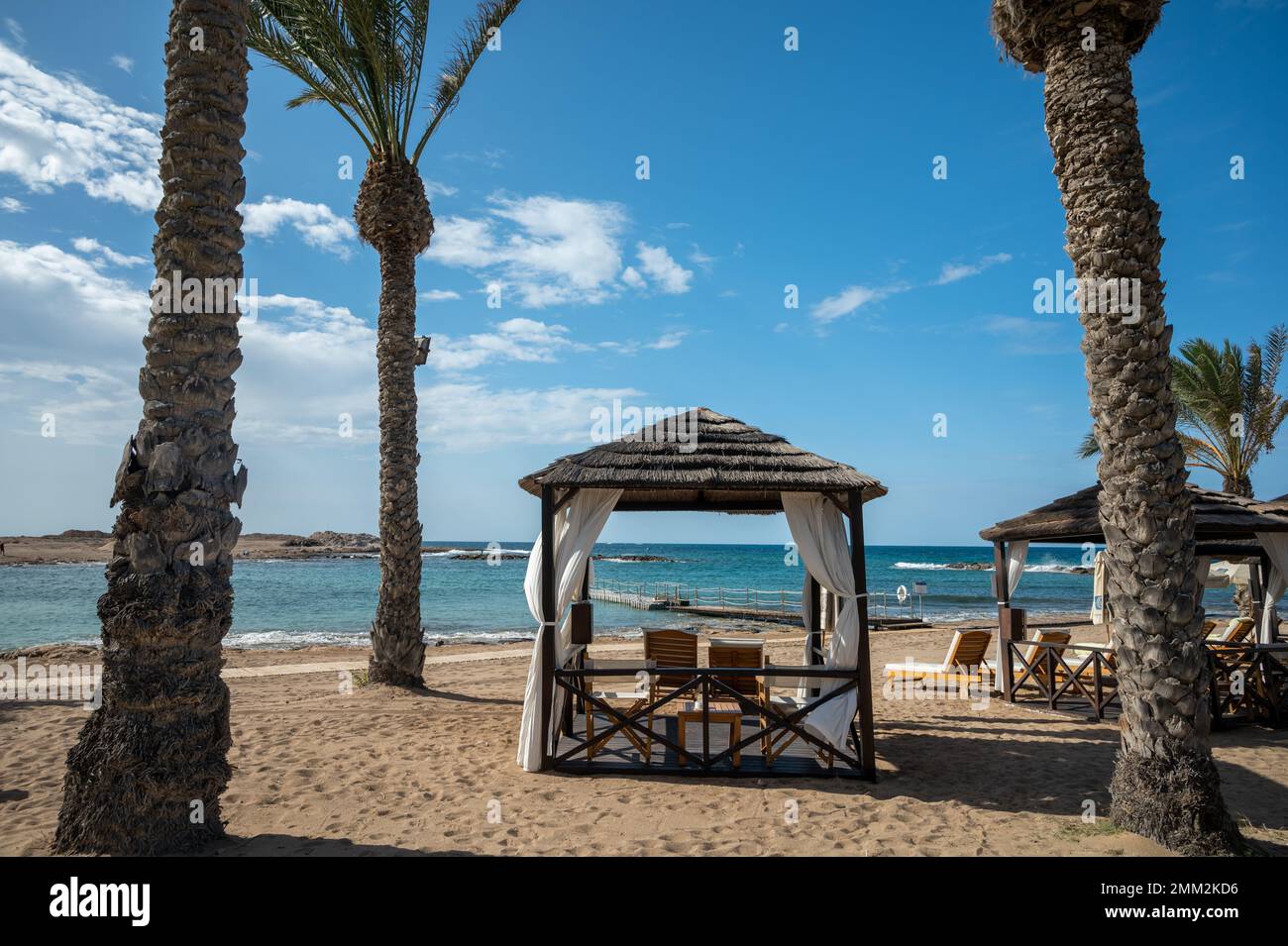 Vacation resorts on Cyprus near Paprhos with green grass, beach ...