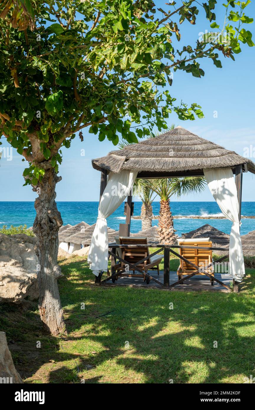 Vacation resorts on Cyprus near Paprhos with green grass, beach ...