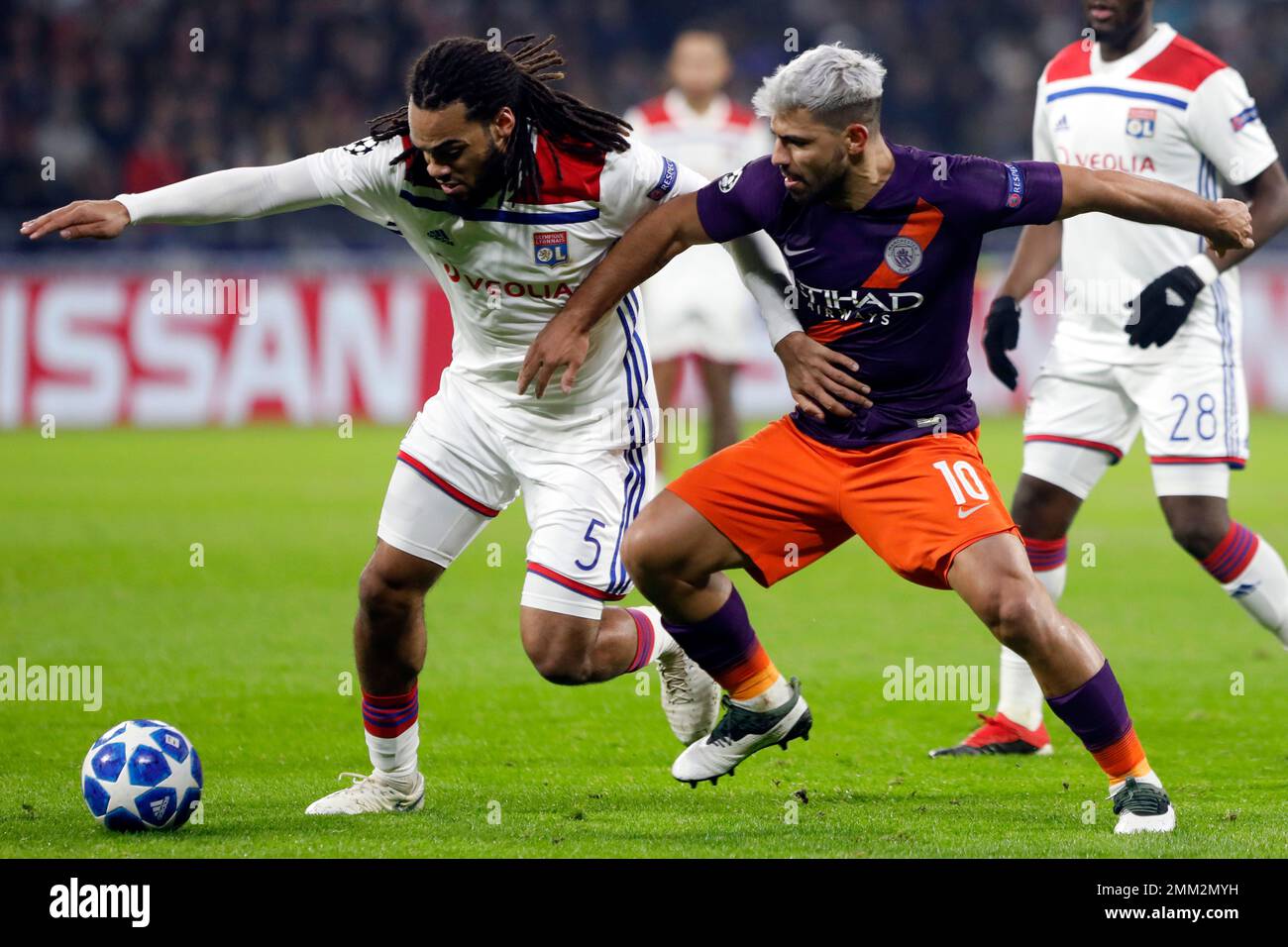 Manchester City forward Sergio Aguero, right, and Lyon defender Jason ...