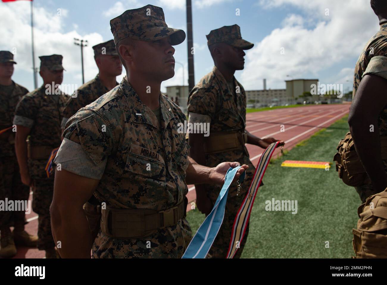 U.S. Marines with 3d Marine Division carry streamers representing the ...