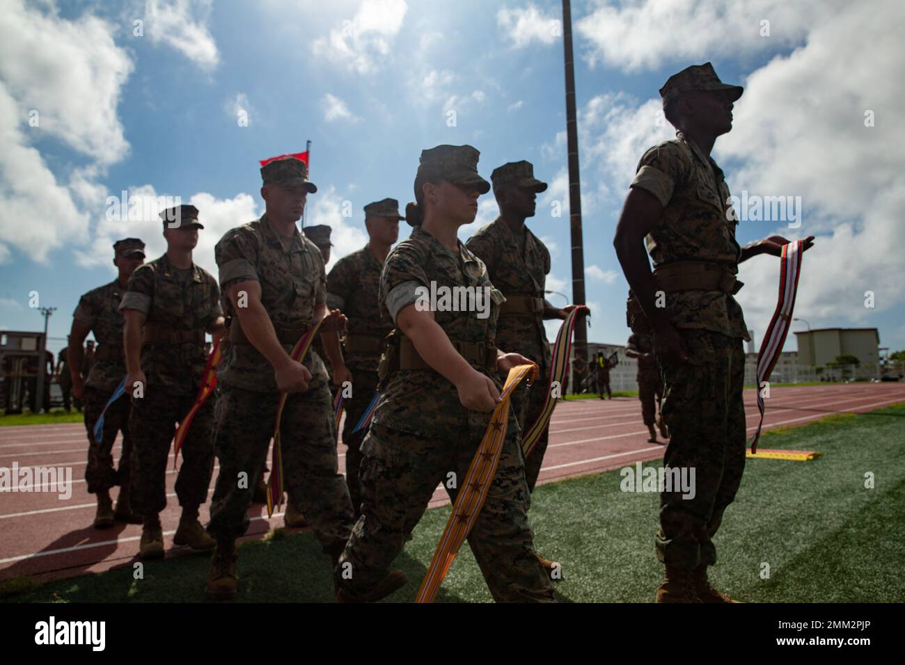 U.S. Marines with 3d Marine Division carry streamers representing the ...