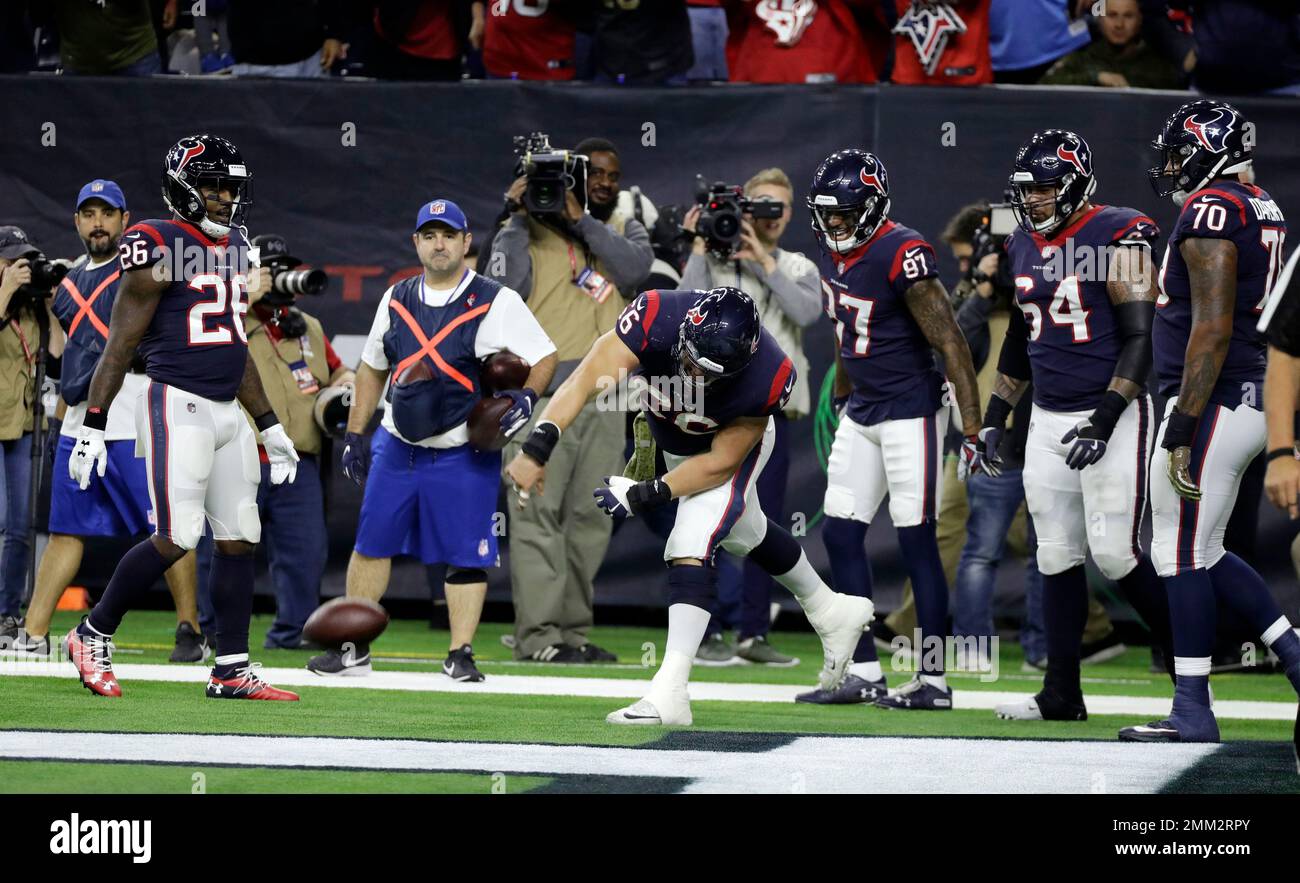 Houston Texans center Nick Martin (66) spikes the ball after ...