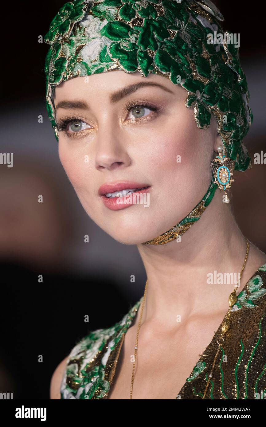 Actress Amber Heard poses for photographers upon arrival at the world ...