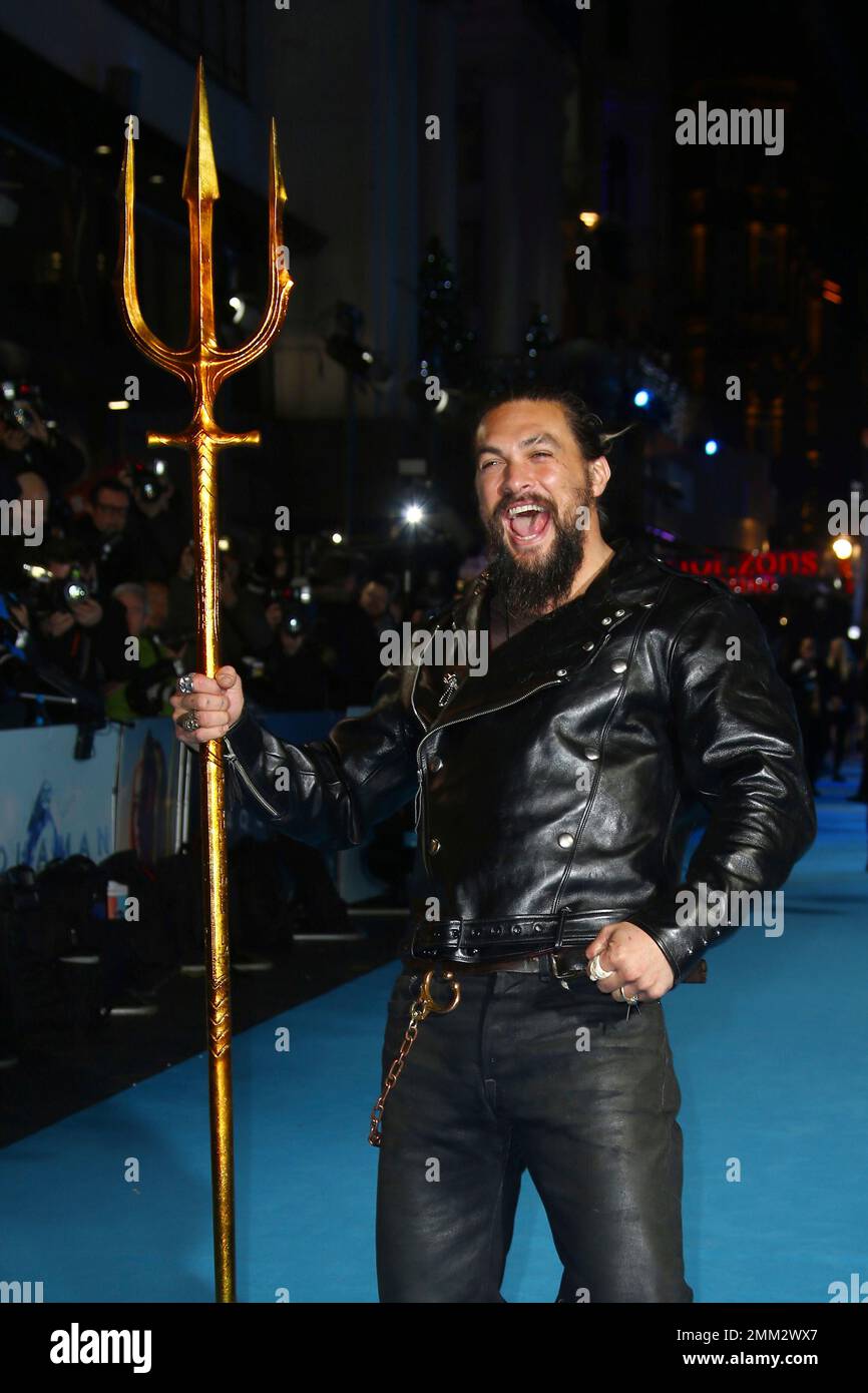 Actor Jason Momoa poses for photographers upon arrival at the premiere ...