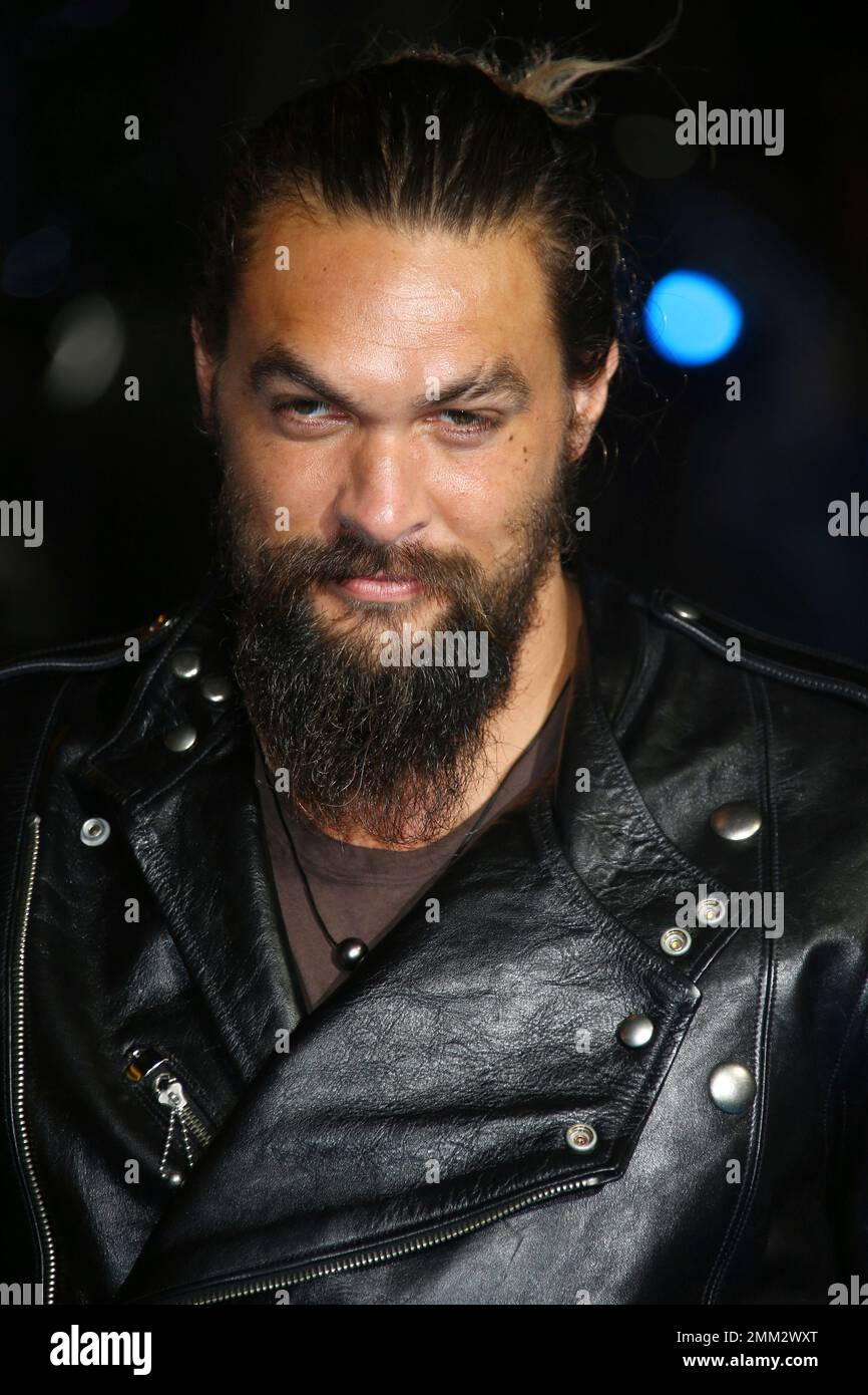 Actor Jason Momoa poses for photographers upon arrival at the premiere ...