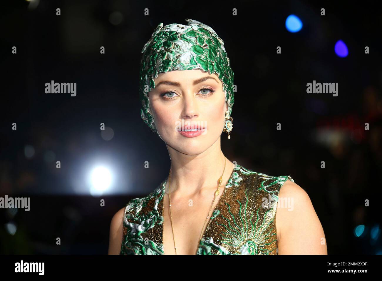 Actress Amber Heard poses for photographers upon arrival at the ...