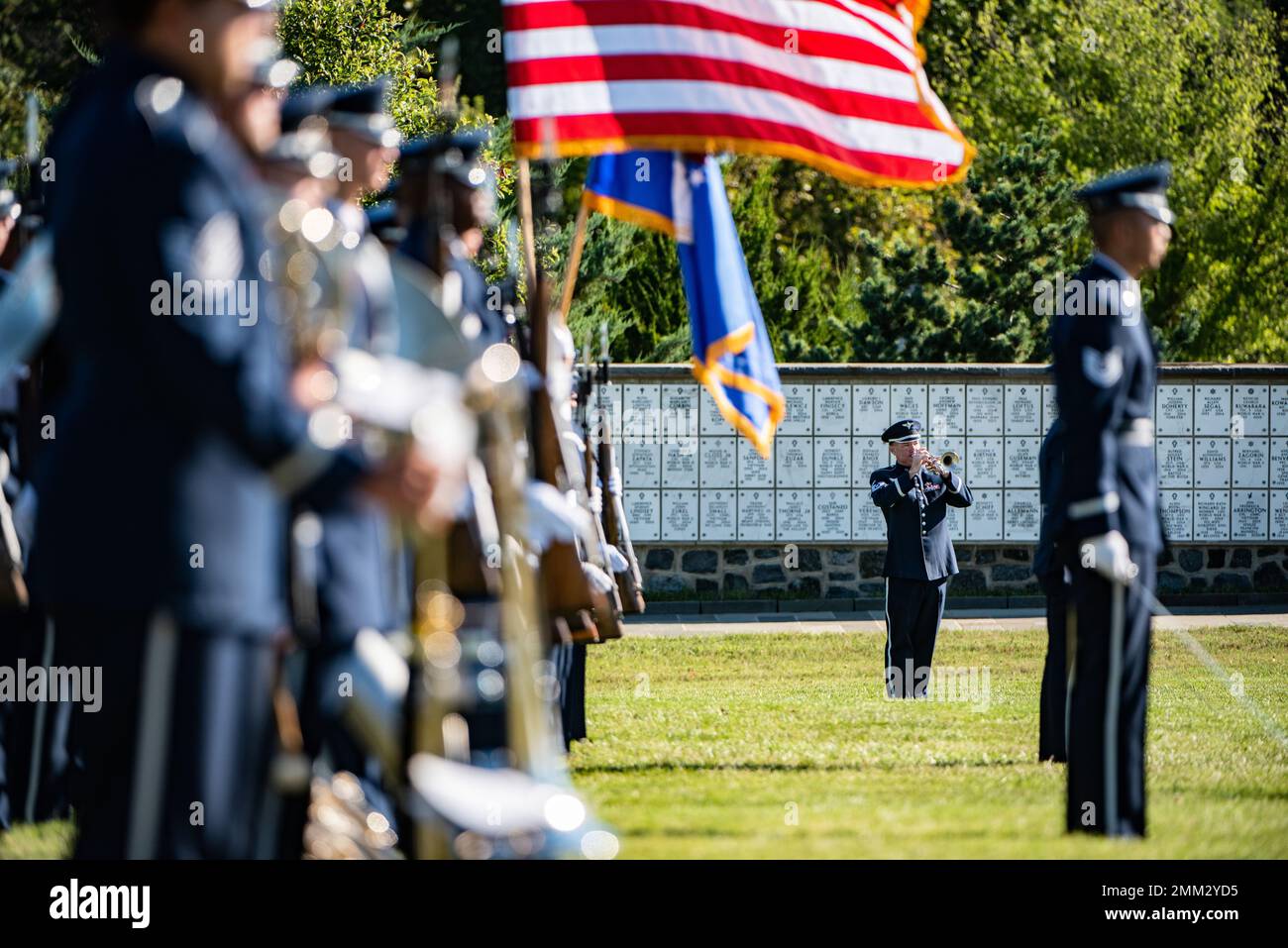 A trumpeter from the U.S. Air Force Ceremonial Brass Band plays "Taps ...