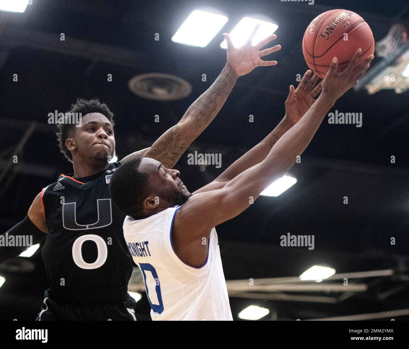 Seton Hall guard Quincy McKnight, right, goes up to the basket past ...