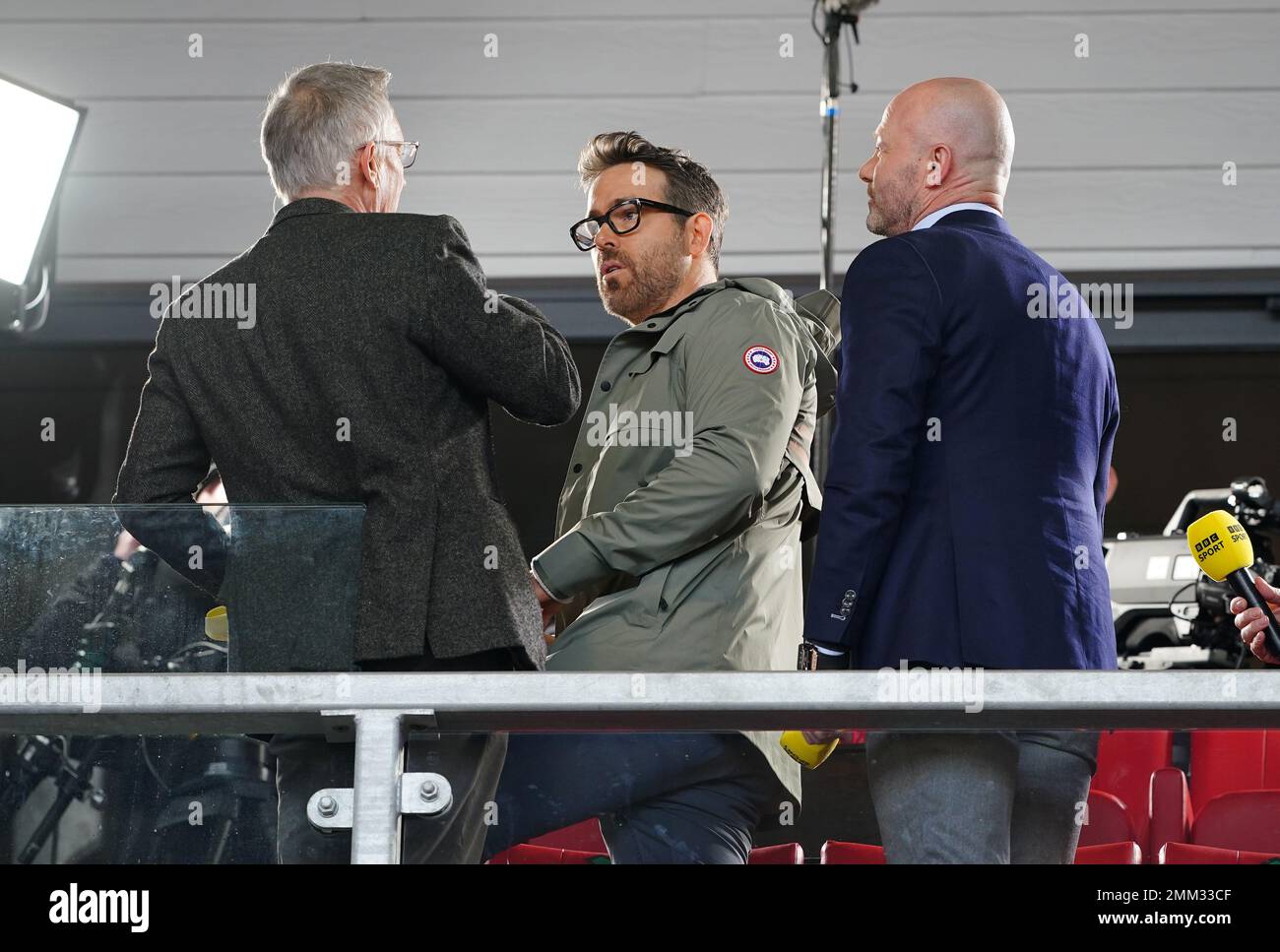 Wrexham co-owner Ryan Reynolds (centre) speaks to BBC Sport's Gary ...