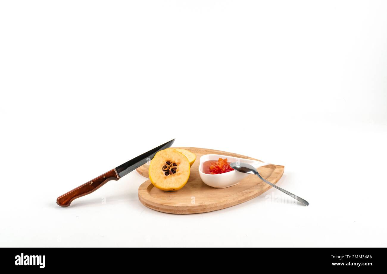 Cutted Top view spoon and knife Fresh ripe quince and jam on white ...