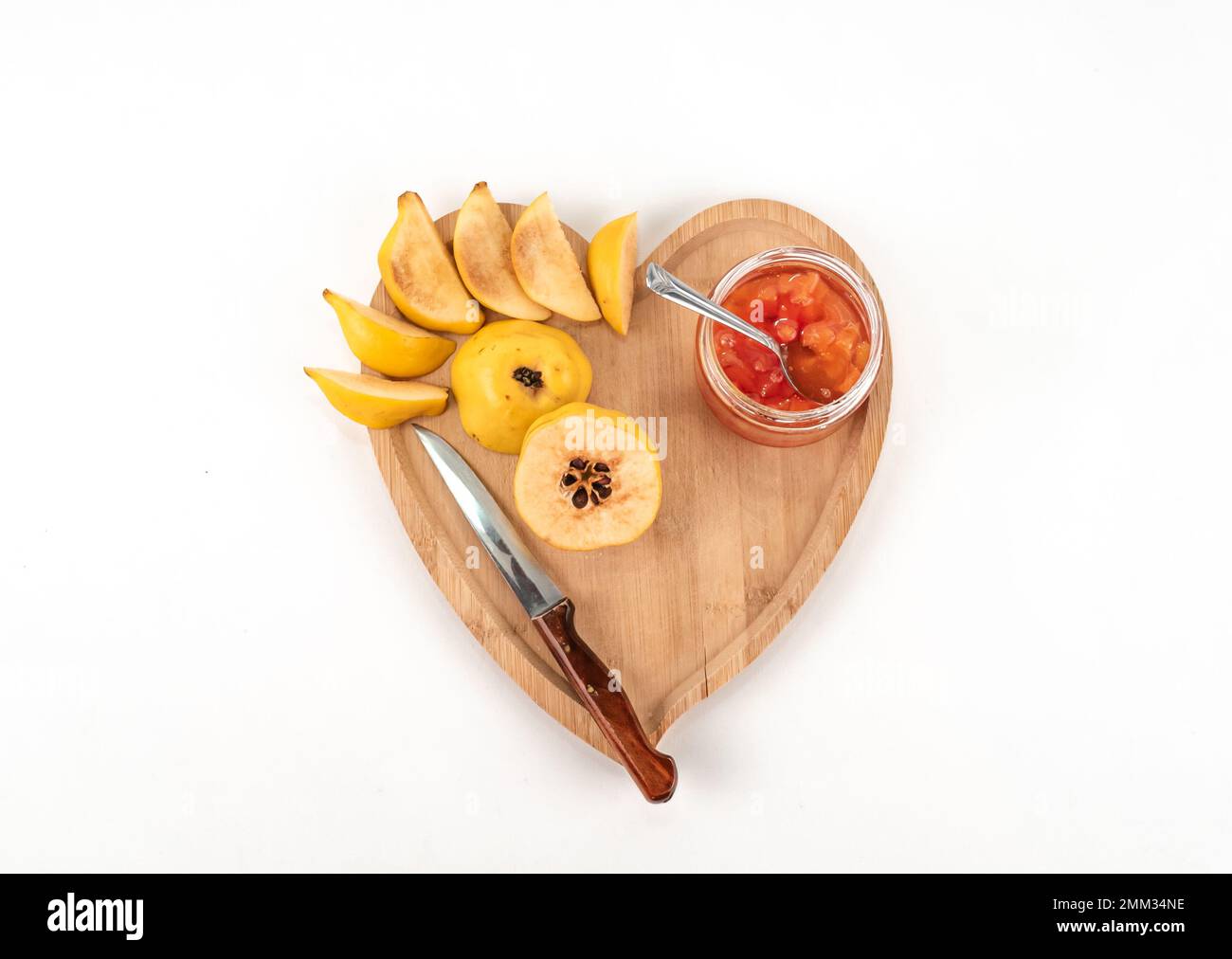 Cutted Top view spoon and knife Fresh ripe quince and jam on white ...