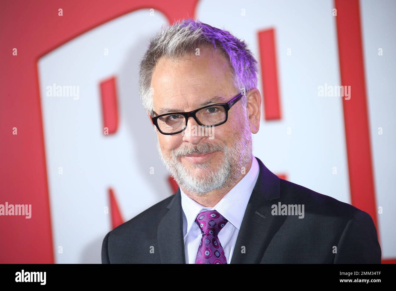 Rich Moore poses for photographers upon arrival at the premiere of the ...