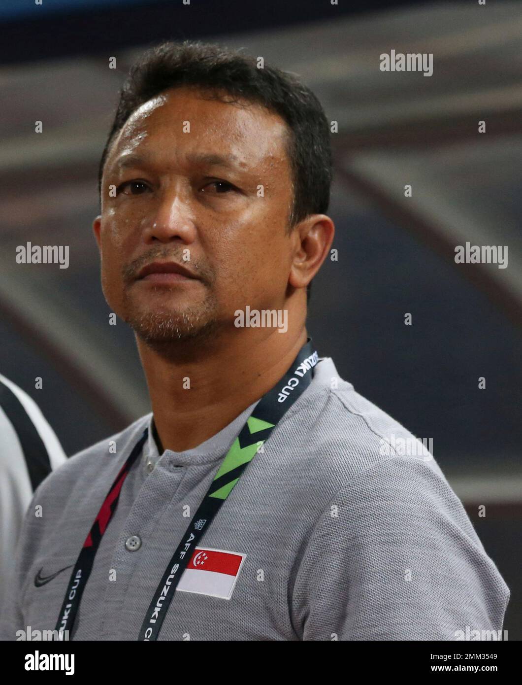 Singapore's Head Coach Fandi Ahmad stand during their AFF Suzuki Cup soccer match at Rajamangala ...