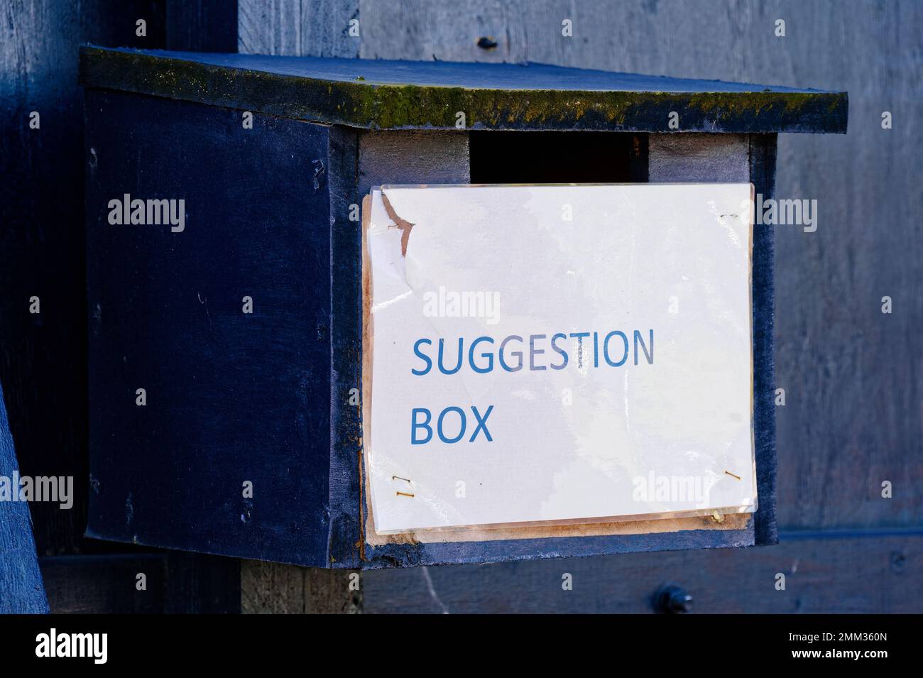 Suggestion box and sign at construction site entrance Stock Photo - Alamy