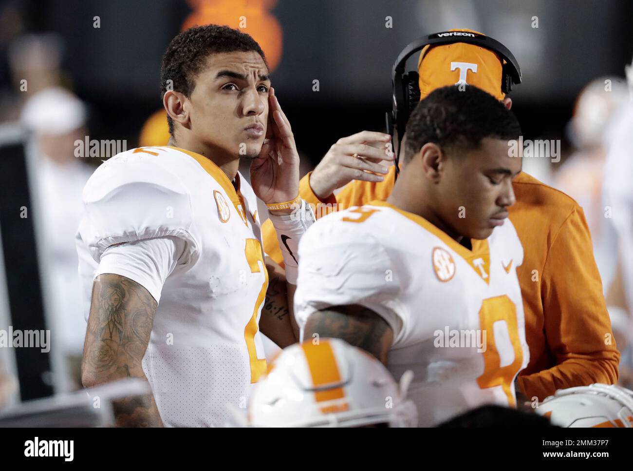 Tennessee quarterback Jarrett Guarantano, left, looks at the scoreboard ...