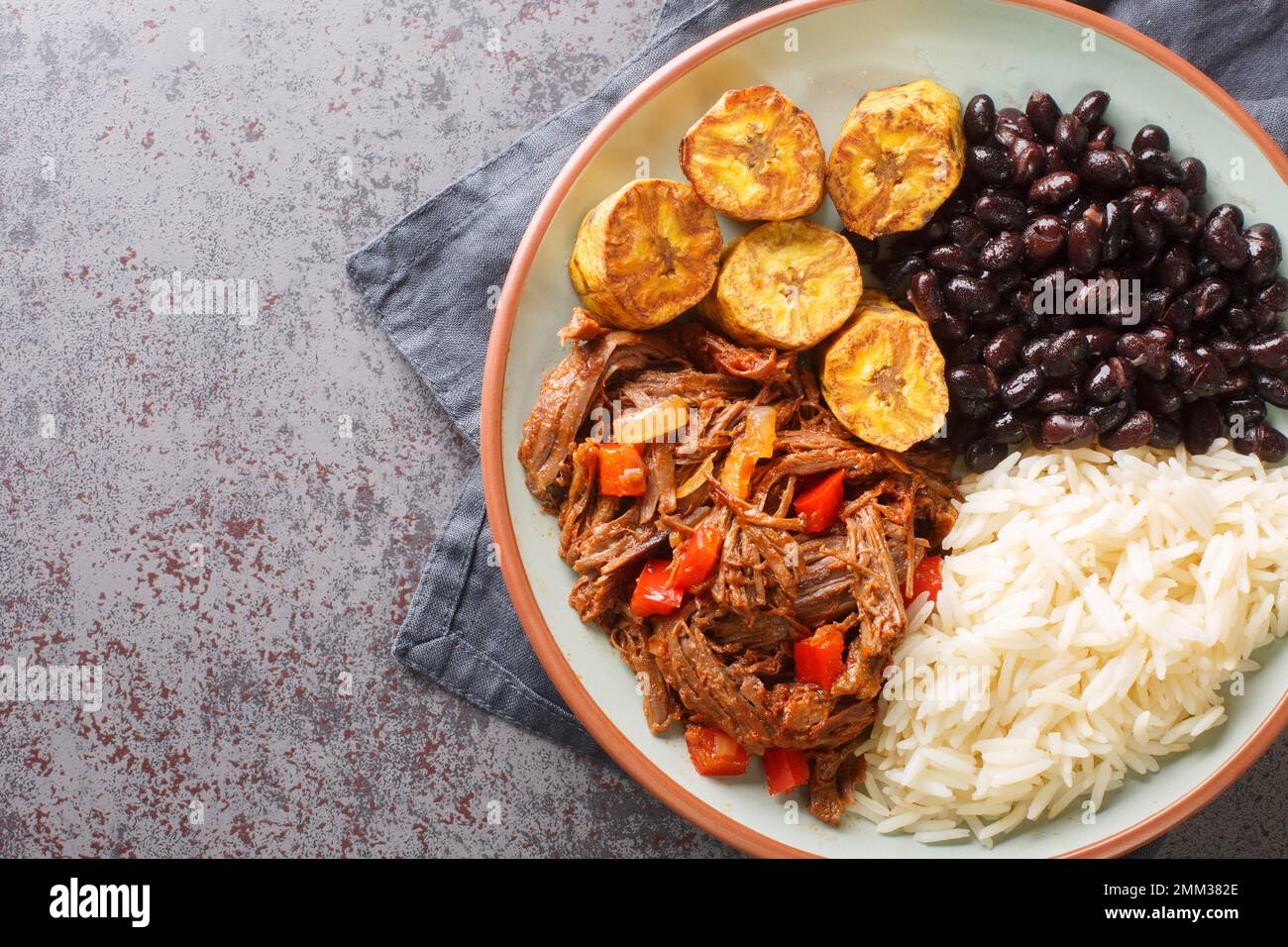 Pabellon criollo is a traditional dish of Venezuela with black beans ...