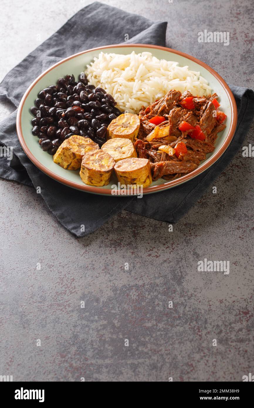 Pabellon criollo is a traditional Venezuelan dish made with shredded ...