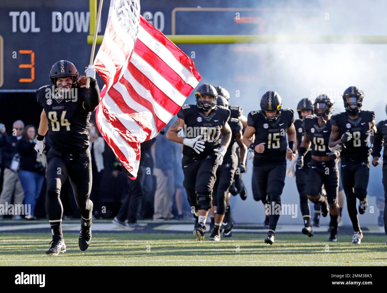Vanderbilt tight end Sam Dobbs (84) carries a flag as the team takes ...