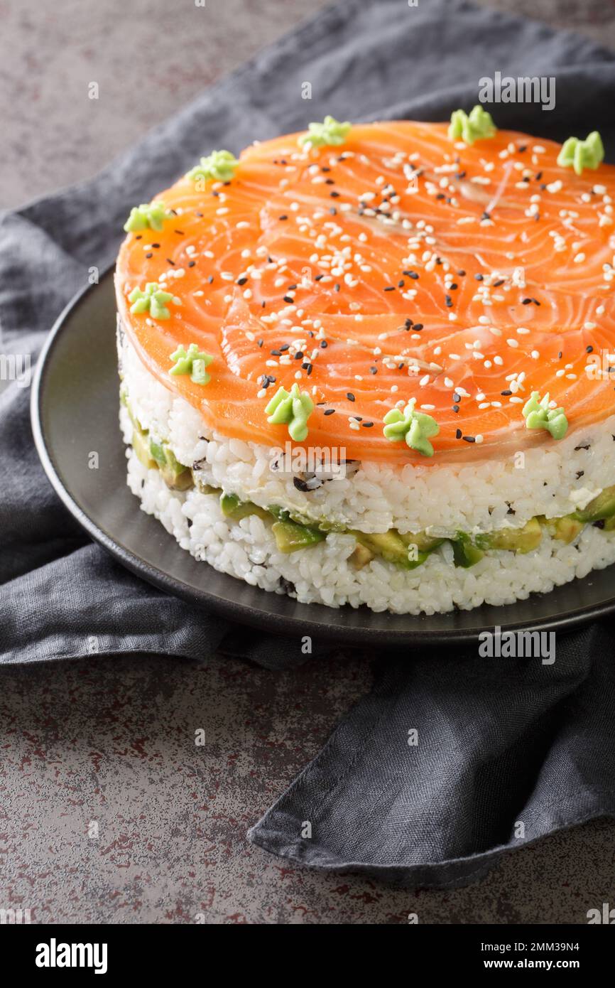 Homemade sushi cake with lightly salted salmon, avocado, soft cheese ...