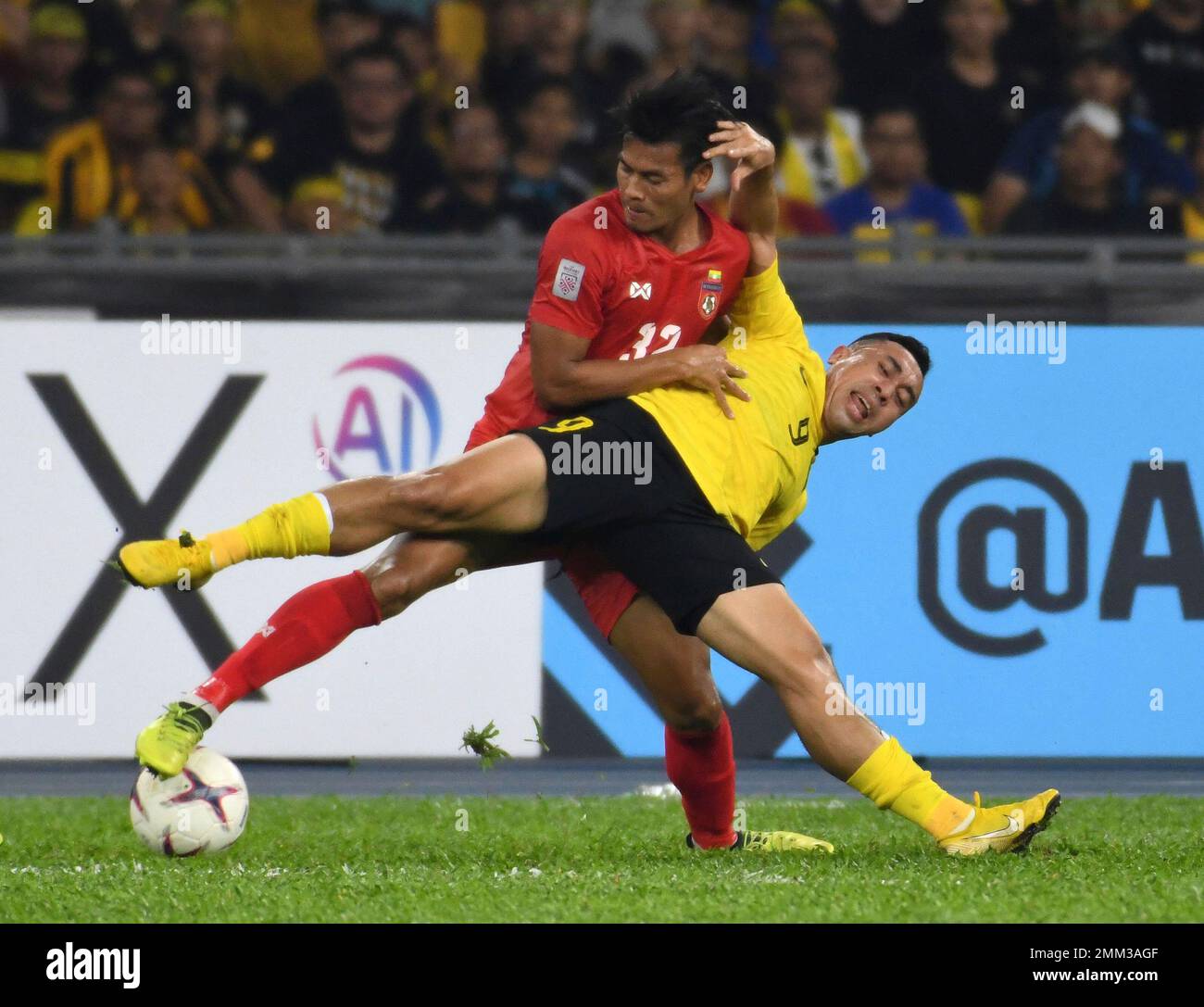 Malaysia's Norshahrul Idlan Talaha, right, battles for the ball with Myanmar Zaw Min Tun, during ...