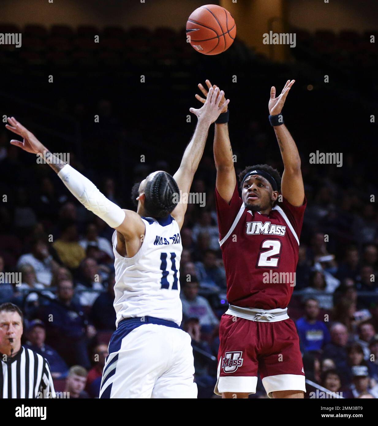 Massachusetts' Luwane Pipkins (2) shoots over Nevada's Cody Martin (11 ...