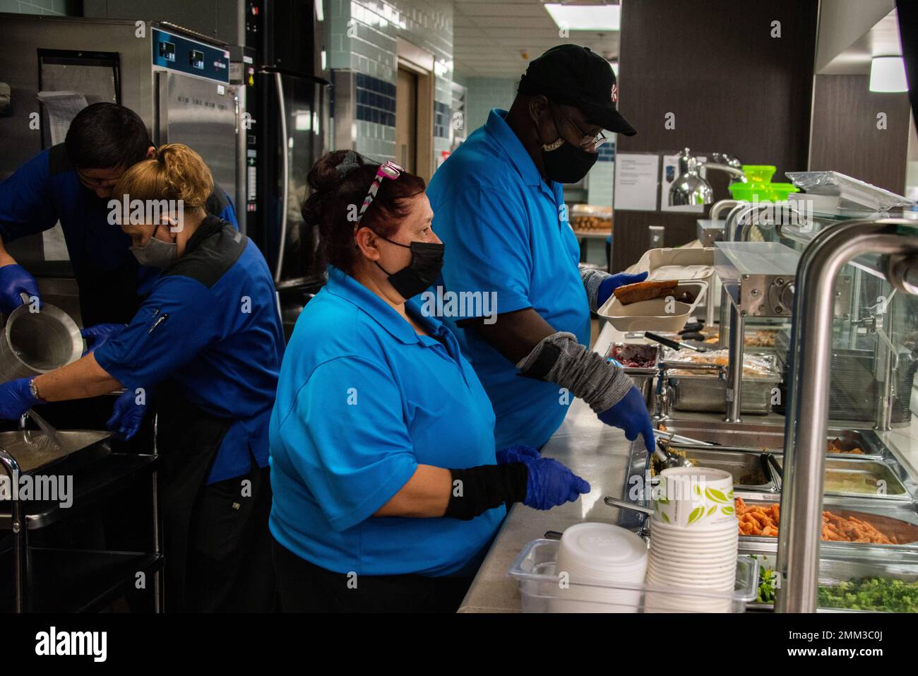 Department of Nutritional Medicine staff members prepare to serve ...
