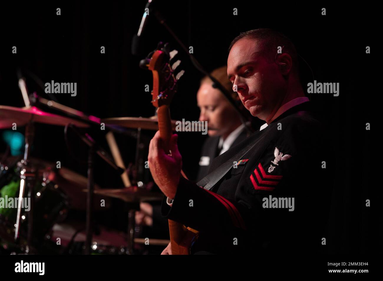 Musician 1st Class Danny Stewart, from Laceyville, Pa., plays bass with ...