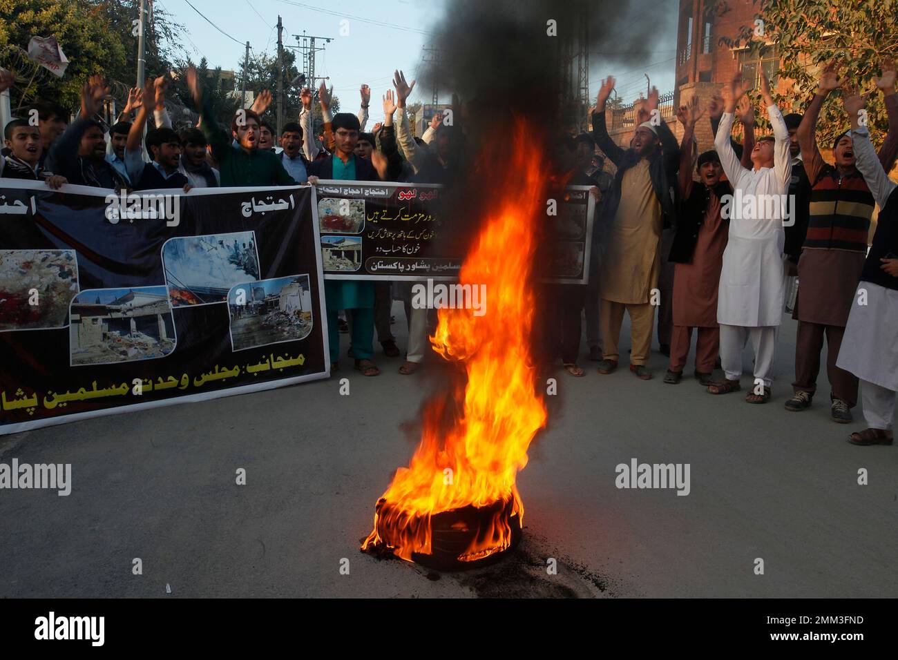 Pakistani students protest to condemn a bombing in Orakzai, in Peshawar ...