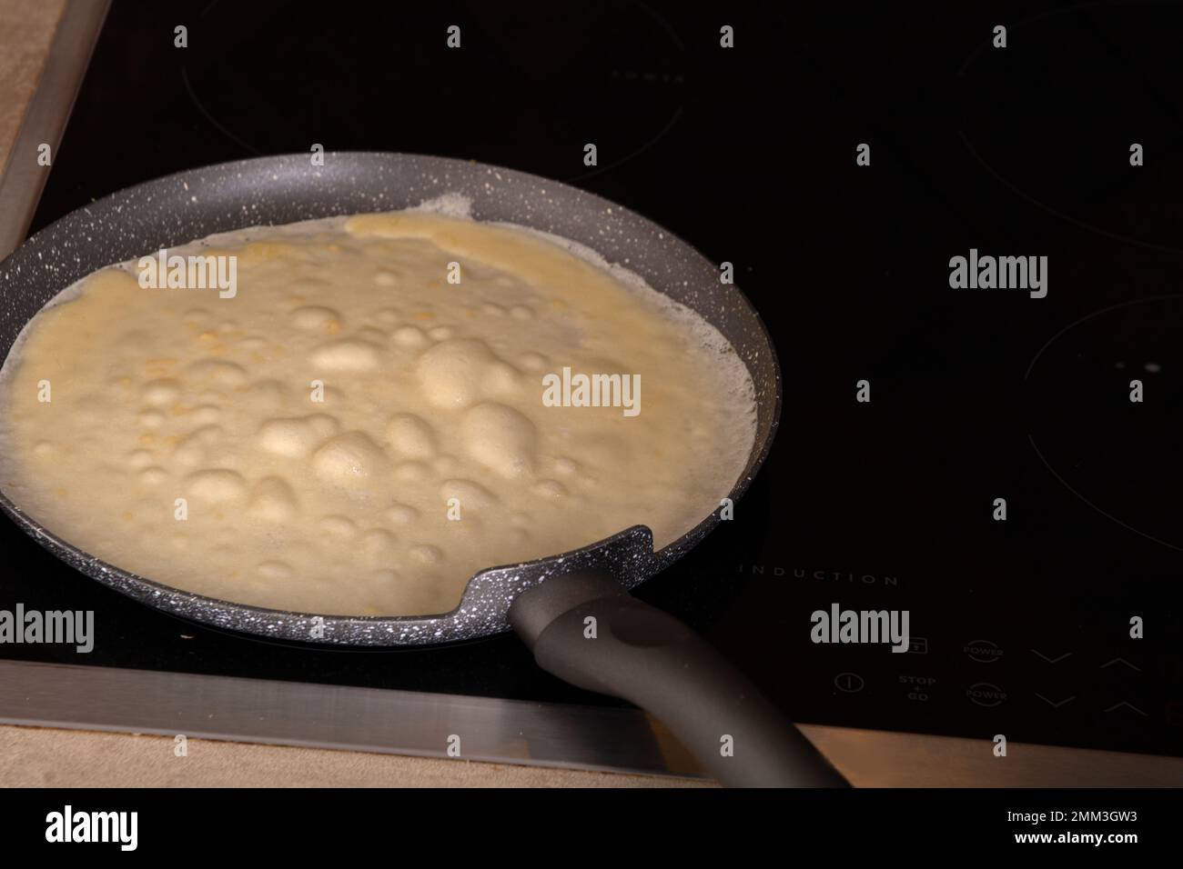 photo pancake frying on a pancake pan Stock Photo - Alamy