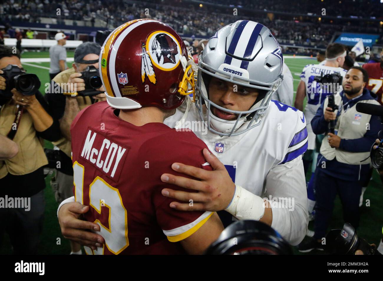 Washington Redskins quarterback Colt McCoy (12) greets Dallas Cowboys ...