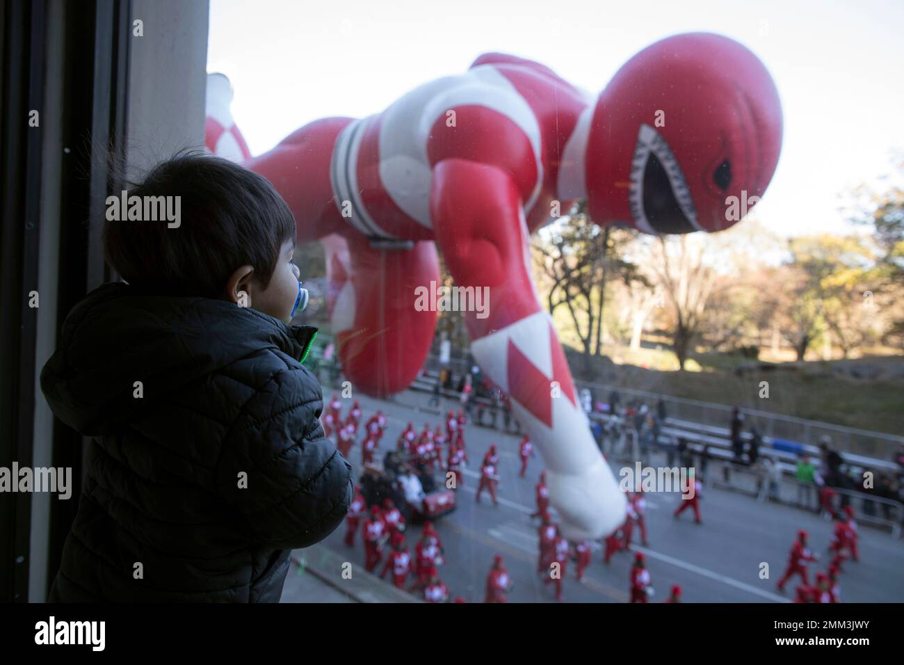 Hudson Garber, 2, watches the Red Mighty Morphin Power Ranger balloon ...