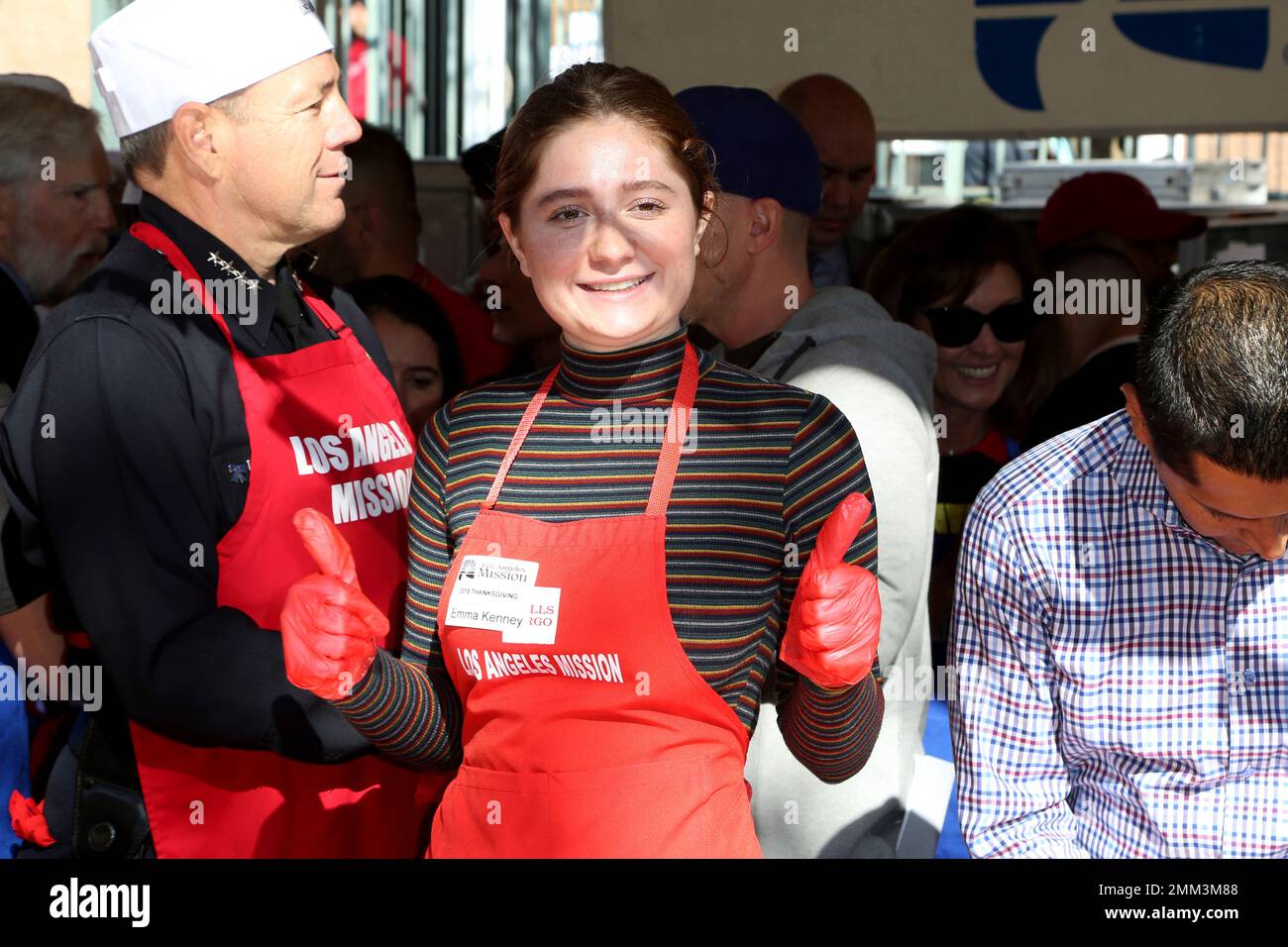 Actress Emma Kenney volunteers to serve Thanksgiving dinner to a group ...