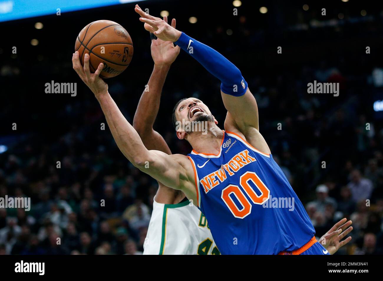New York Knicks' Enes Kanter (00) goes up to shoot against Boston ...
