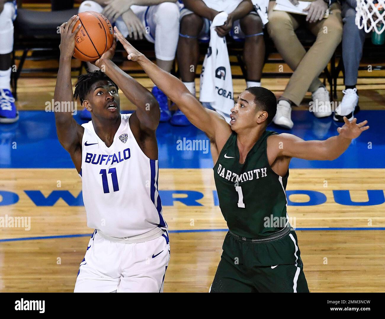 Buffalo forward Jeenathan Williams, left, is defended by Dartmouth ...