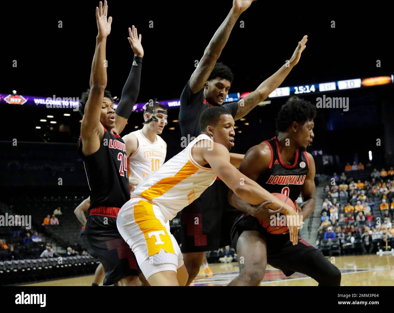 Louisville's Darius Perry (2) and Tennessee's Grant Williams (2) fight ...