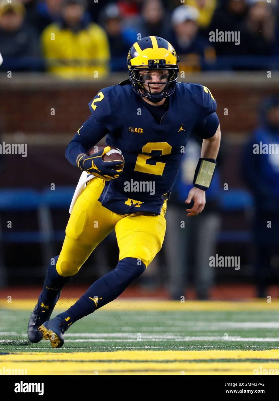 Michigan quarterback Shea Patterson runs against Indiana in the first ...