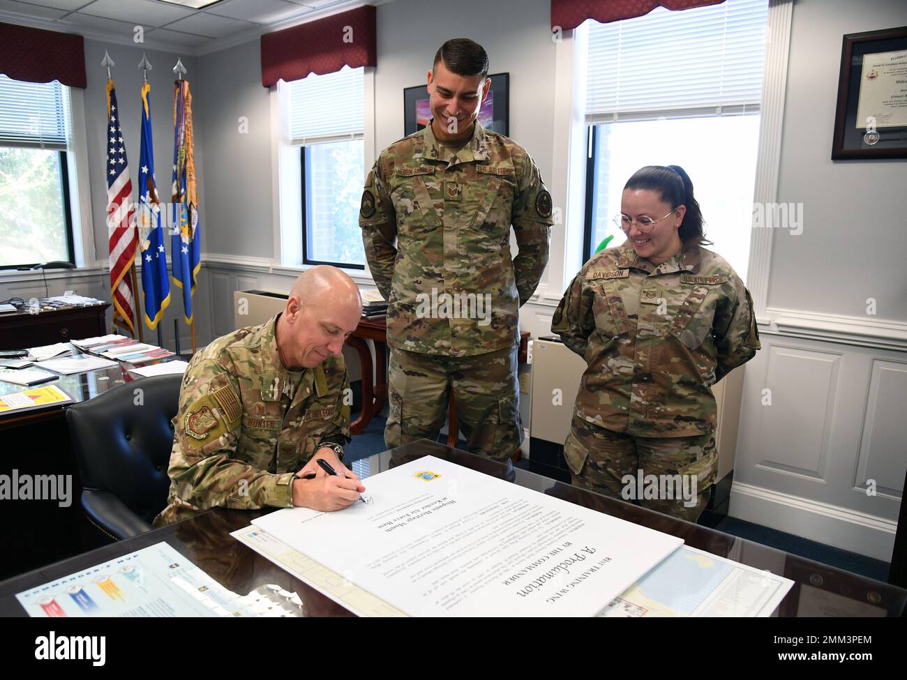 U.S. Air Force Col. William Hunter, 81st Training Wing commander, signs ...