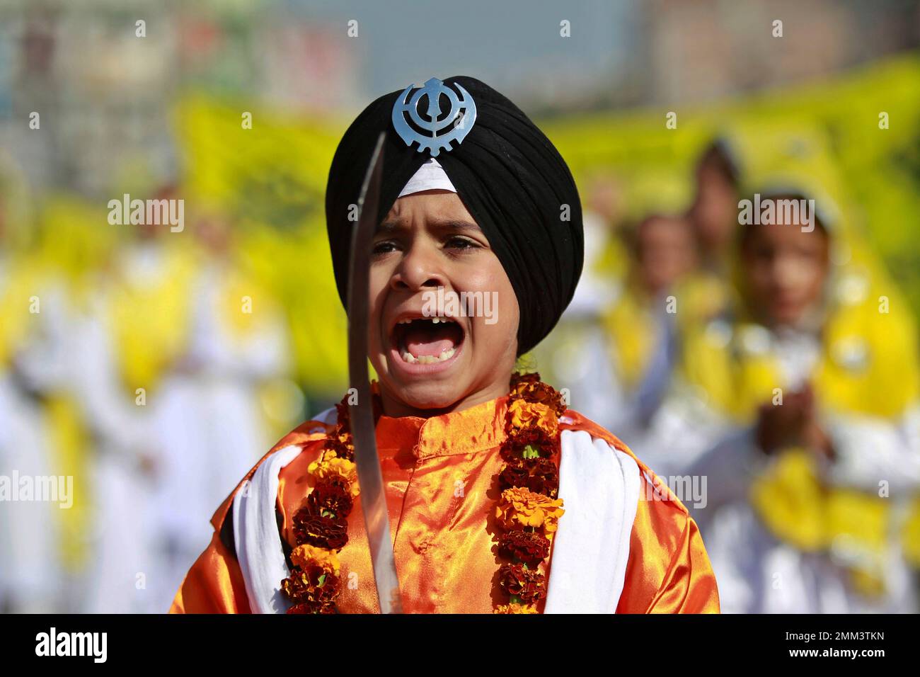 A young Sikh boy shouts religious slogans during a procession ahead of ...