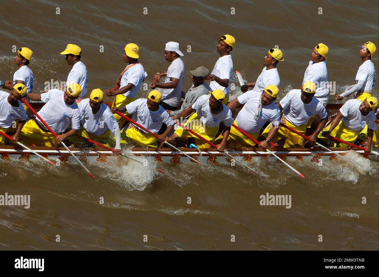 Crew paddle their traditional boat during the annual water festival in ...