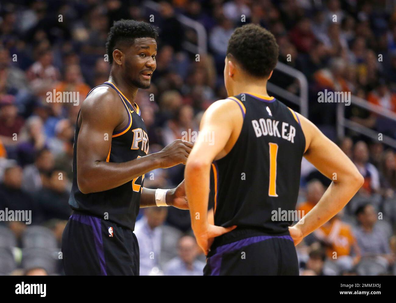 Phoenix Suns center Deandre Ayton (22) and Devin Booker (1) in the ...