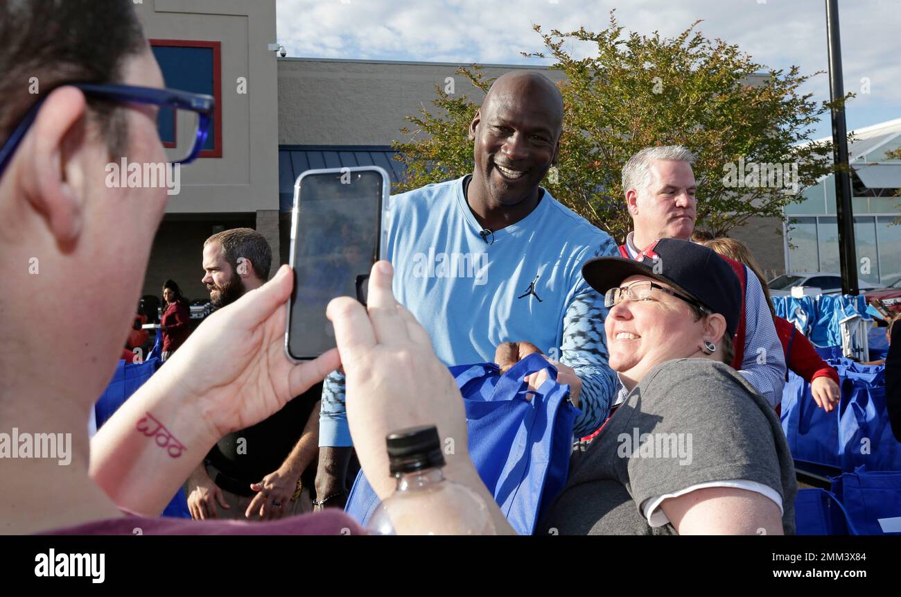 Charlotte Hornets owner Michael Jordan poses for a photo while greeting ...