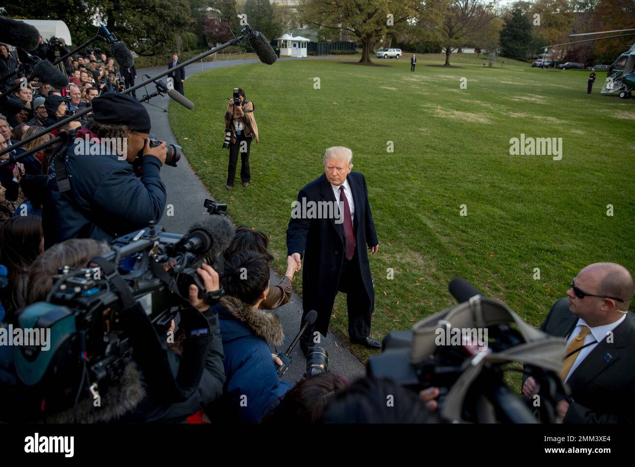 President Donald Trump greets guests on the South Lawn of the White ...