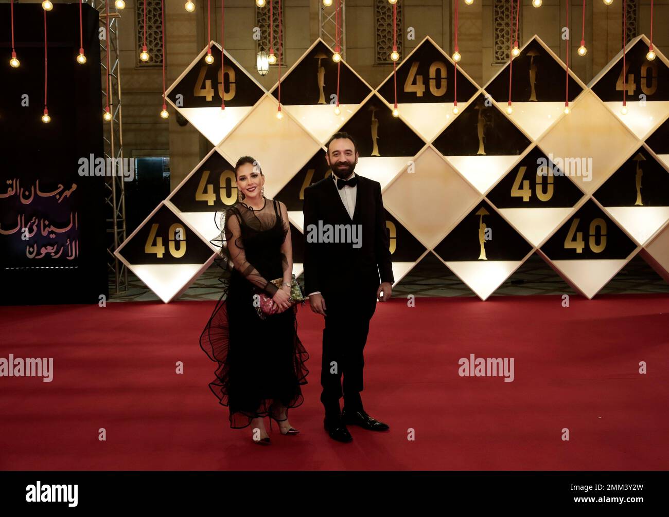 Egyptian film director Amr Salama, right, poses on the red carpet ...