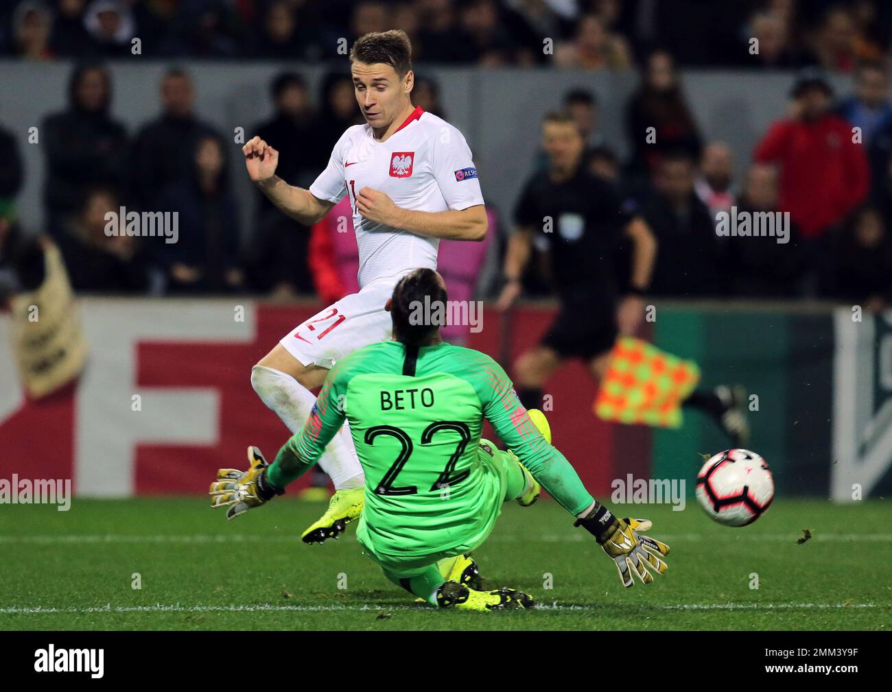 Portugal goalkeeper Beto saves a shot from Poland's Przemyslaw ...