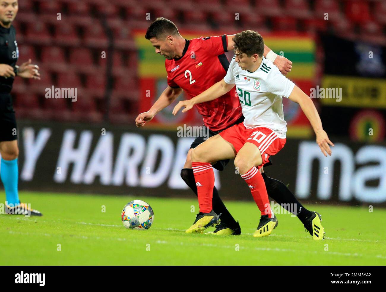 Albania's Andi Lila, back, and Wales' Daniel James fight for the ball ...