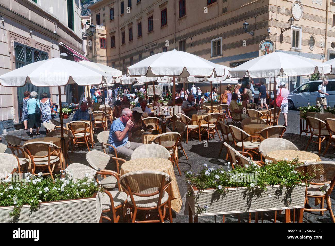 Outside cafe tables in Amalfi, Italy Stock Photo - Alamy